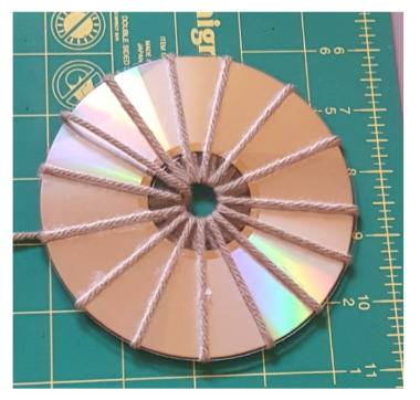 Upcycle CDs into Woven Coasters - The Cleveland Moms